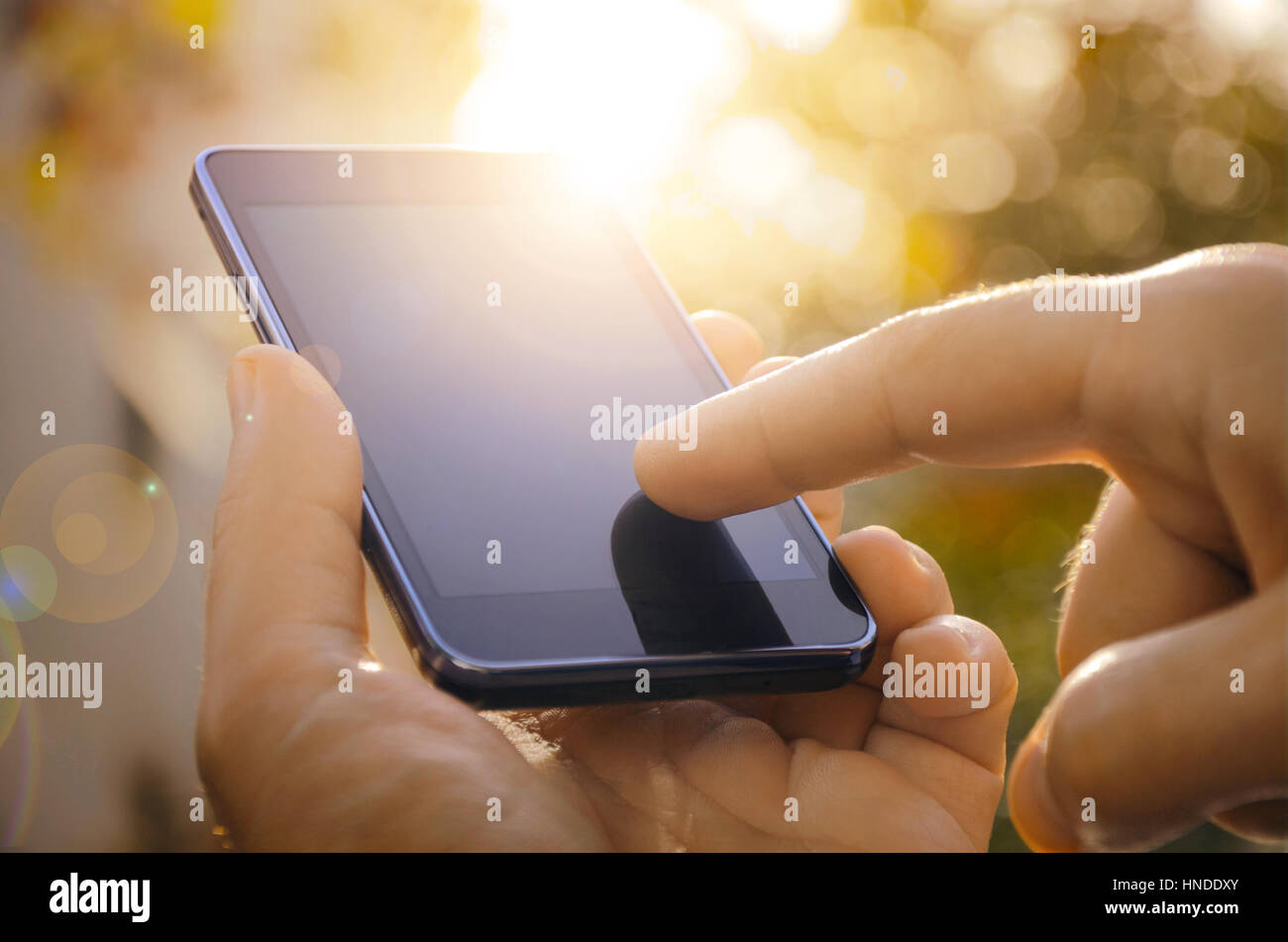 Man’s hand touching screen on modern mobile smart phone Stock Photo - Alamy