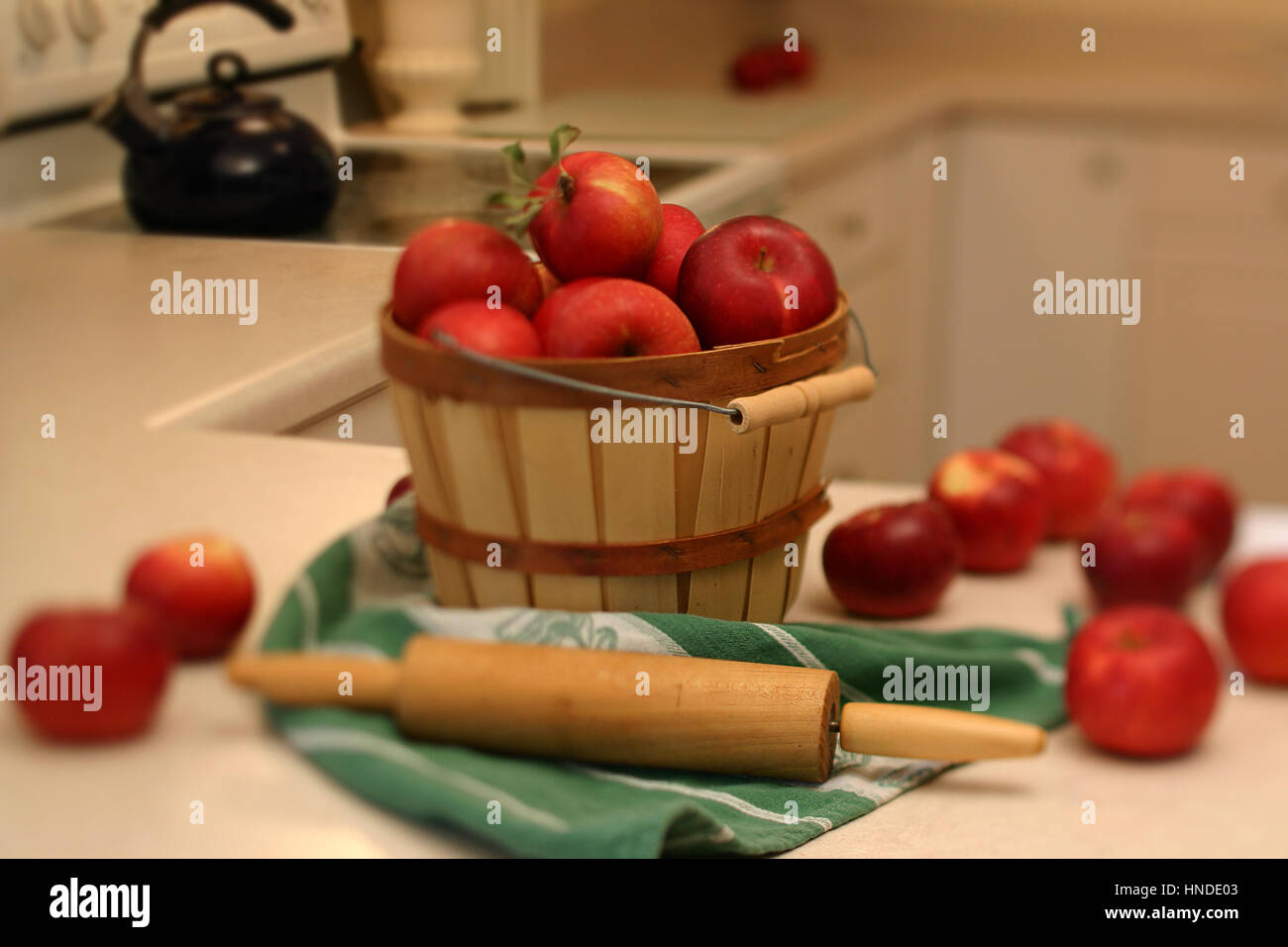 A basket of apples sitting on the counter in a kitchen Stock Photo - Alamy