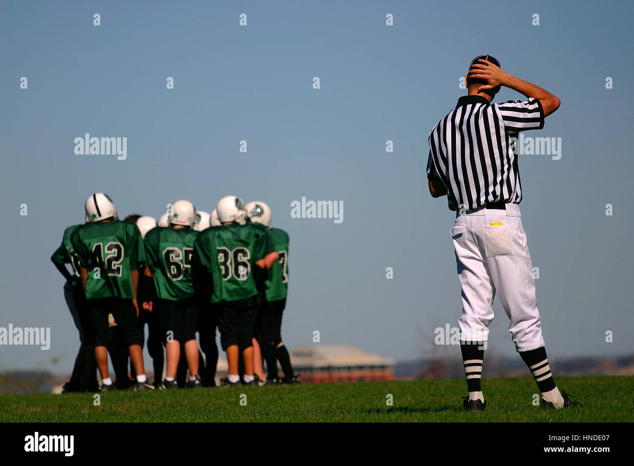 Referee with football team Stock Photo - Alamy