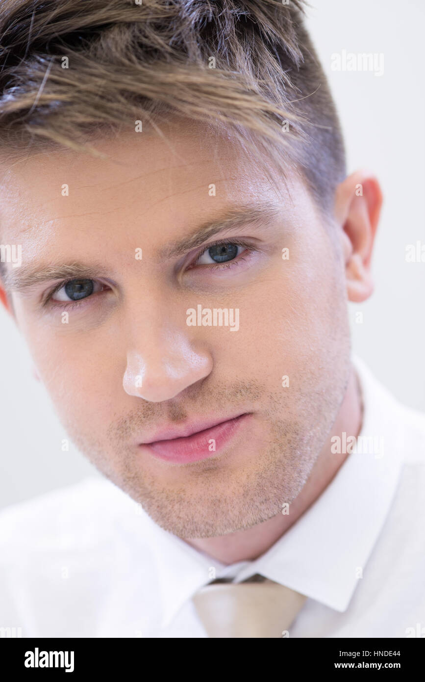 Portrait of a young handsome man in a representative strict clothing ...