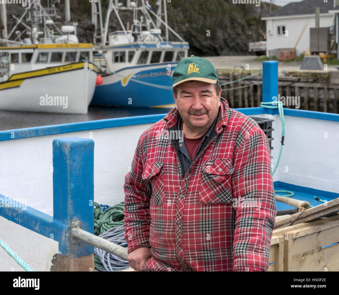 Portrait of a fisherman on his boat, Trout River, Newfoundland Stock ...
