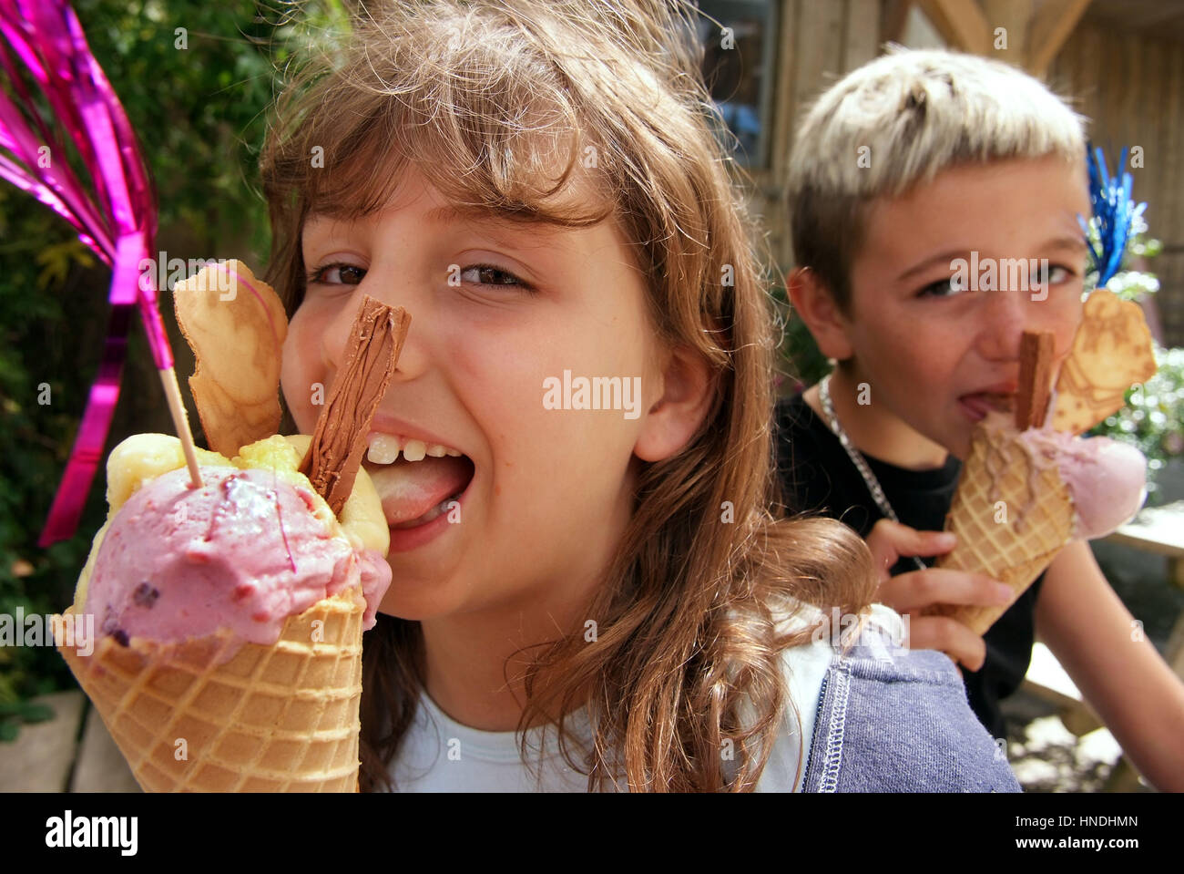 A boy and girl eating Roskilly's Cornish ice-cream Stock Photo - Alamy
