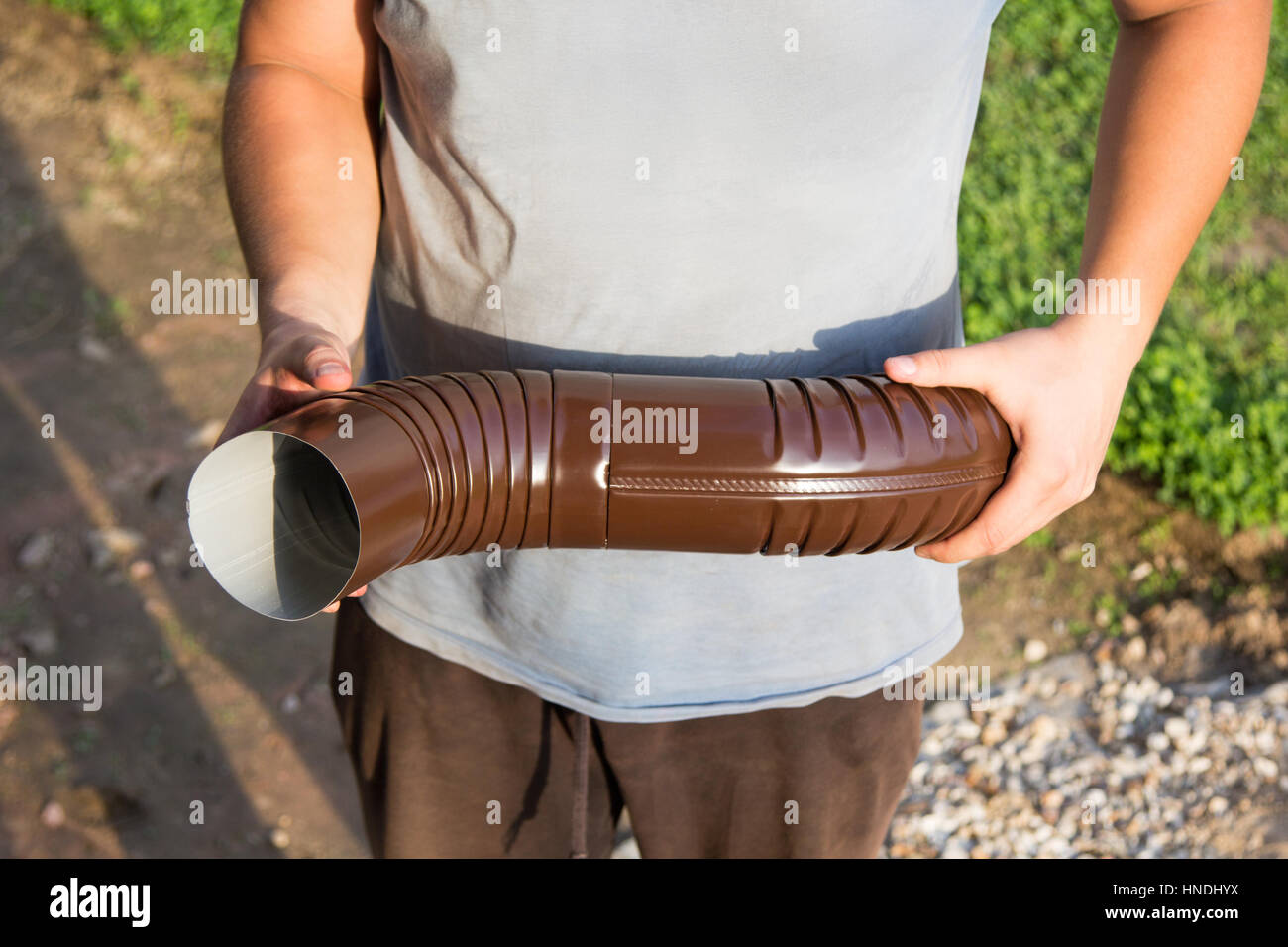 Man holding metal pipe hi-res stock photography and images - Alamy