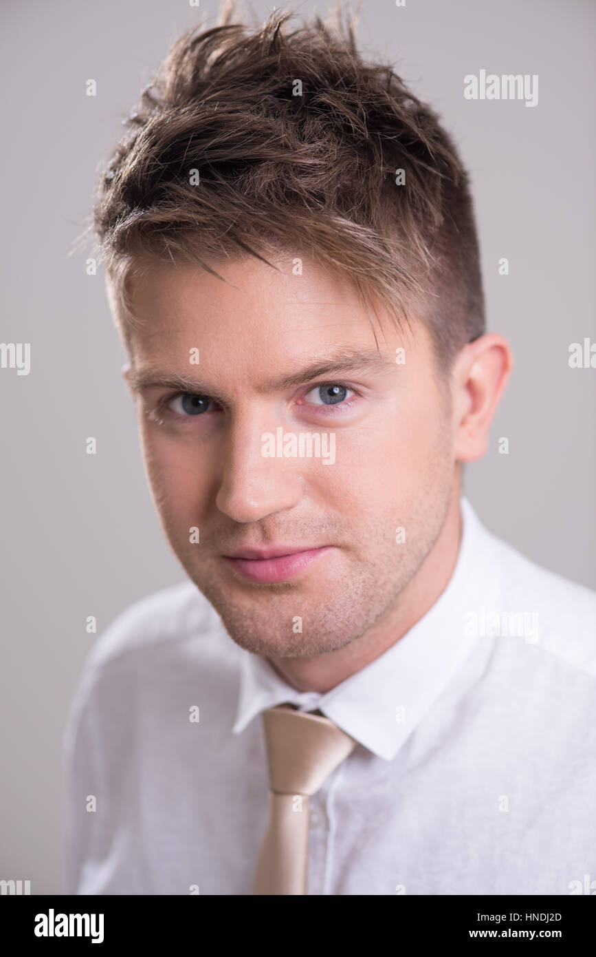 Portrait of a young handsome man in a representative strict clothing ...
