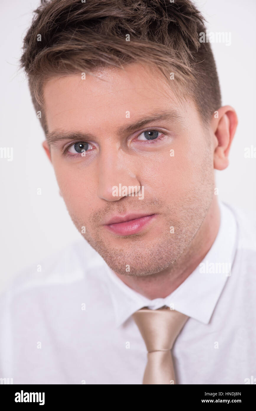 Portrait of a young handsome man in a representative strict clothing ...