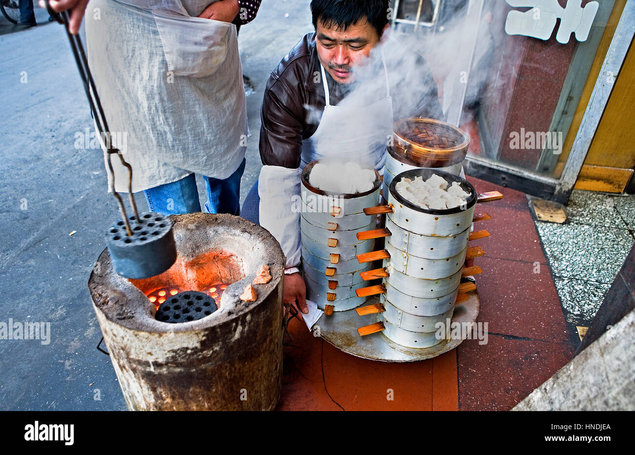 Cooking & selling dumplings, in Dazhalan Jie,Beijing, China Stock Photo ...