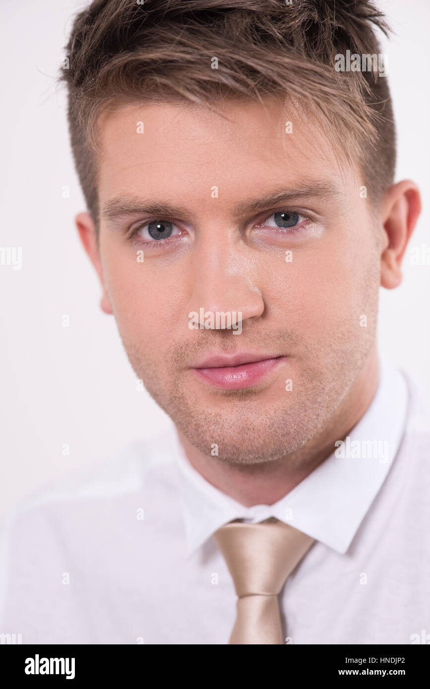 Portrait of a young handsome man in a representative strict clothing ...