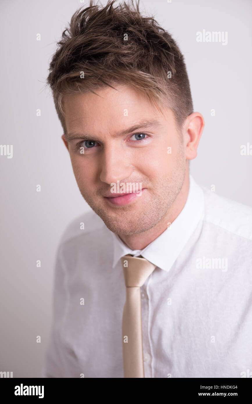Portrait of a young handsome man in a representative strict clothing ...