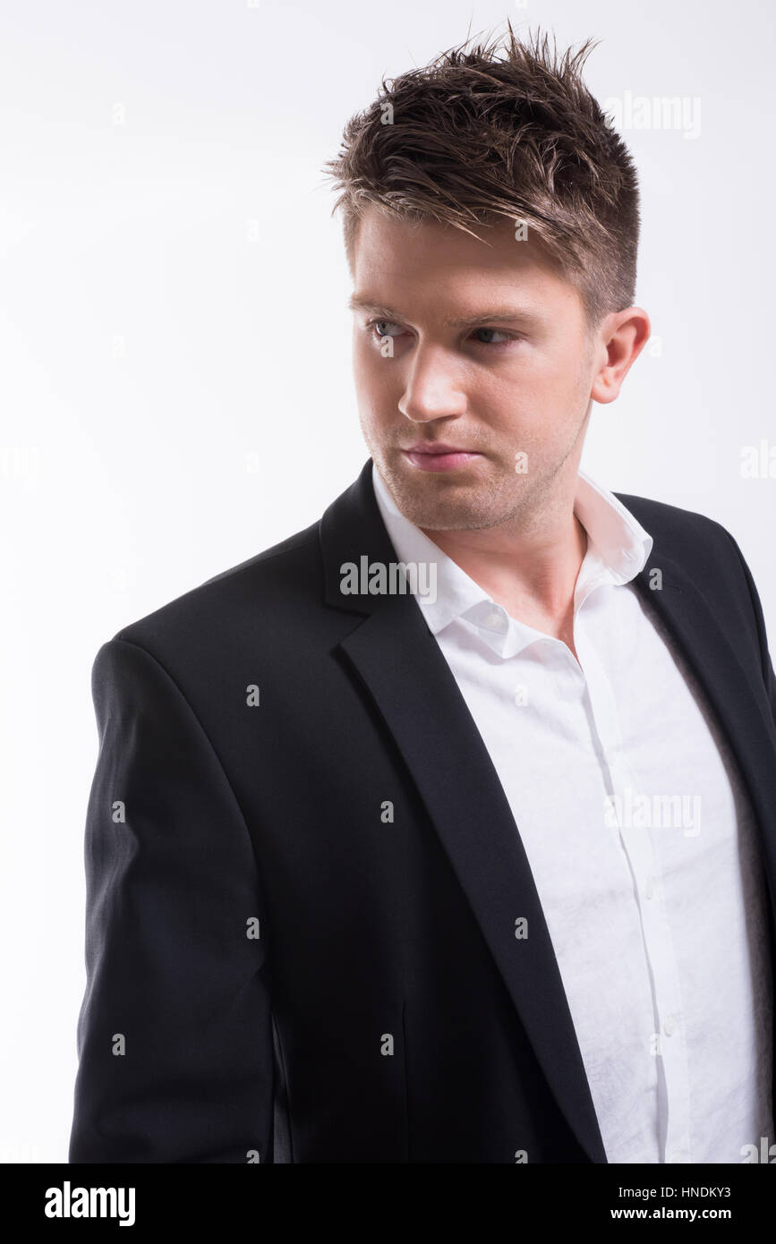 Portrait of a young handsome man in a representative strict clothing ...