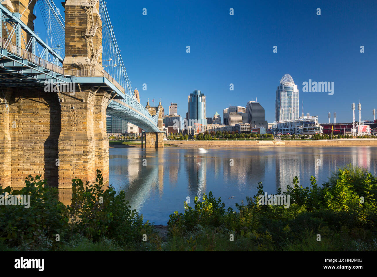 The city skyline and reflections in the Ohio River of Cincinnati, Ohio ...