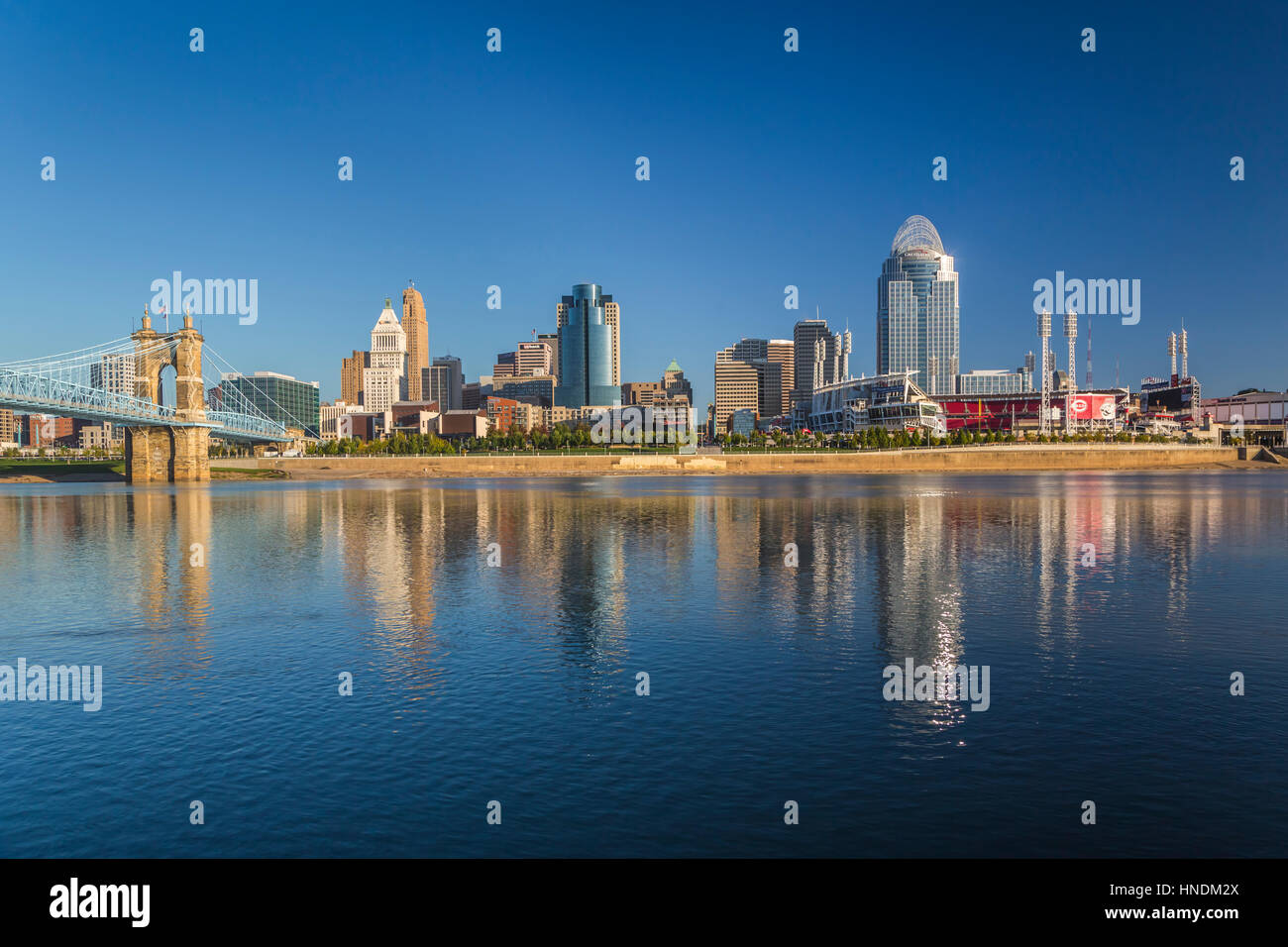 The city skyline and reflections in the Ohio River of Cincinnati, Ohio ...