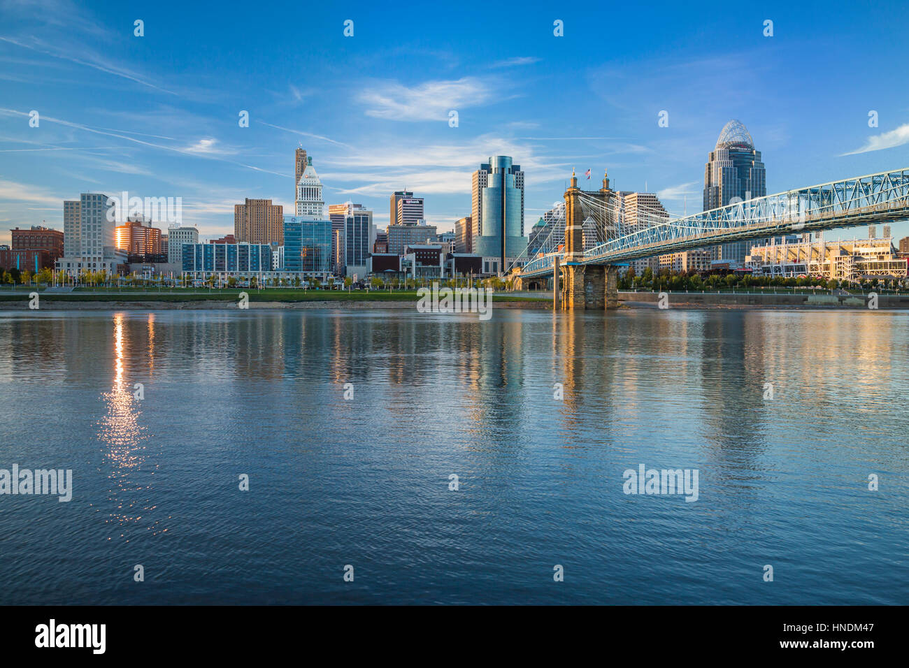 The city skyline and reflections in the Ohio River of Cincinnati, Ohio ...