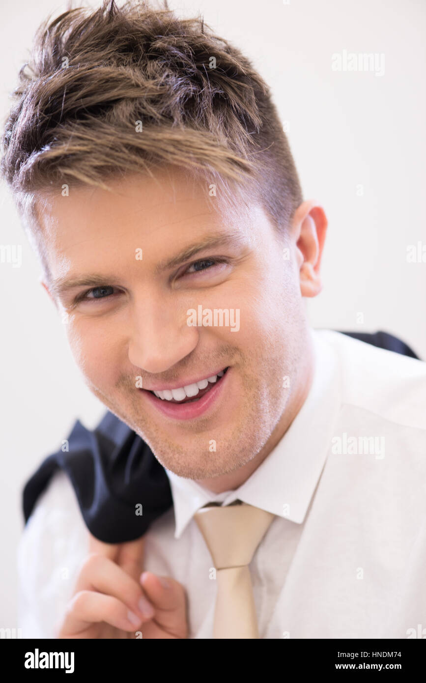 Portrait of a young handsome man in a representative strict clothing ...