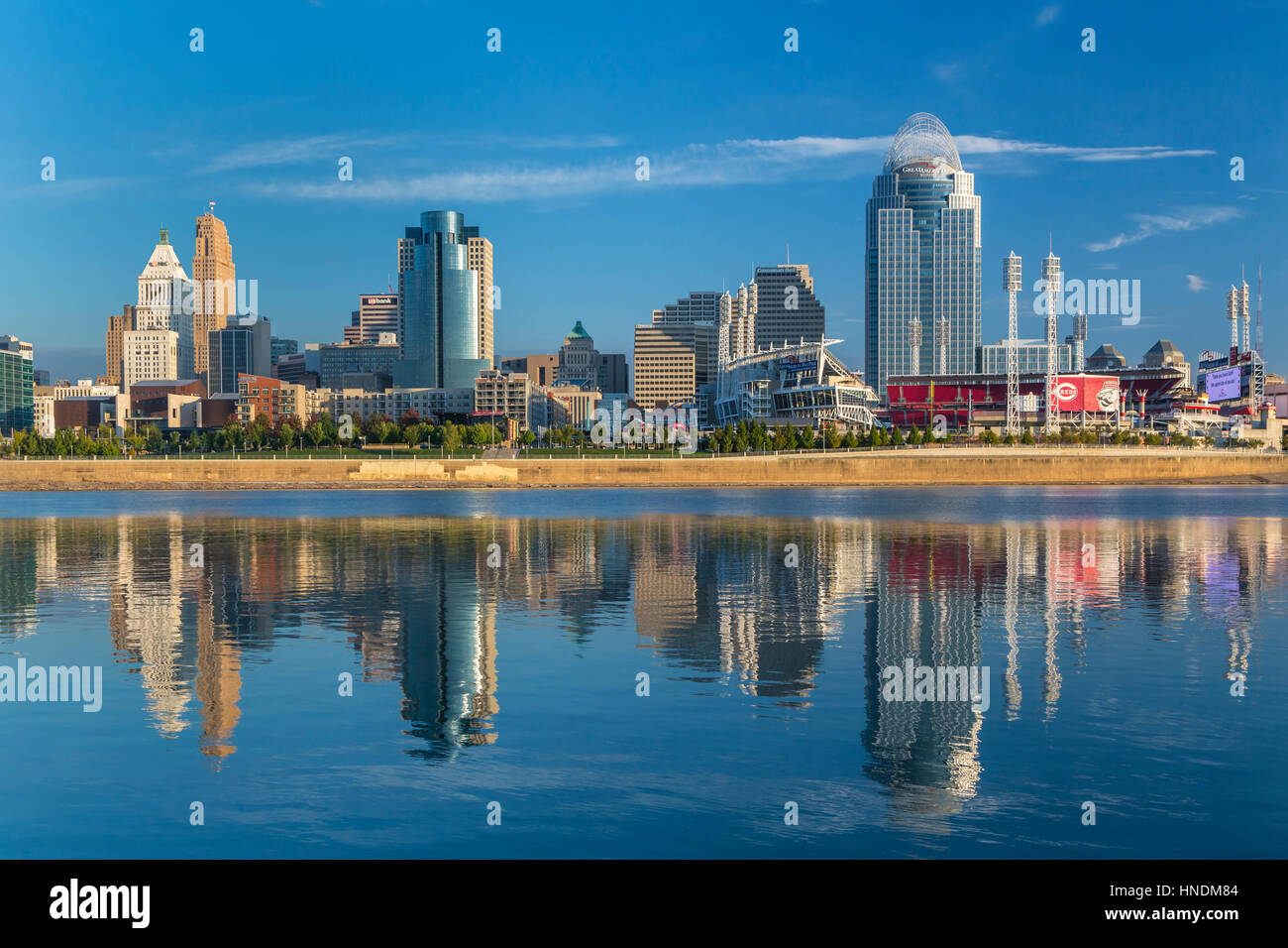 The city skyline and reflections in the Ohio River of Cincinnati, Ohio ...