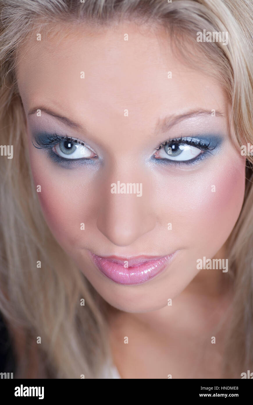 Beautiful young woman looking up Stock Photo - Alamy