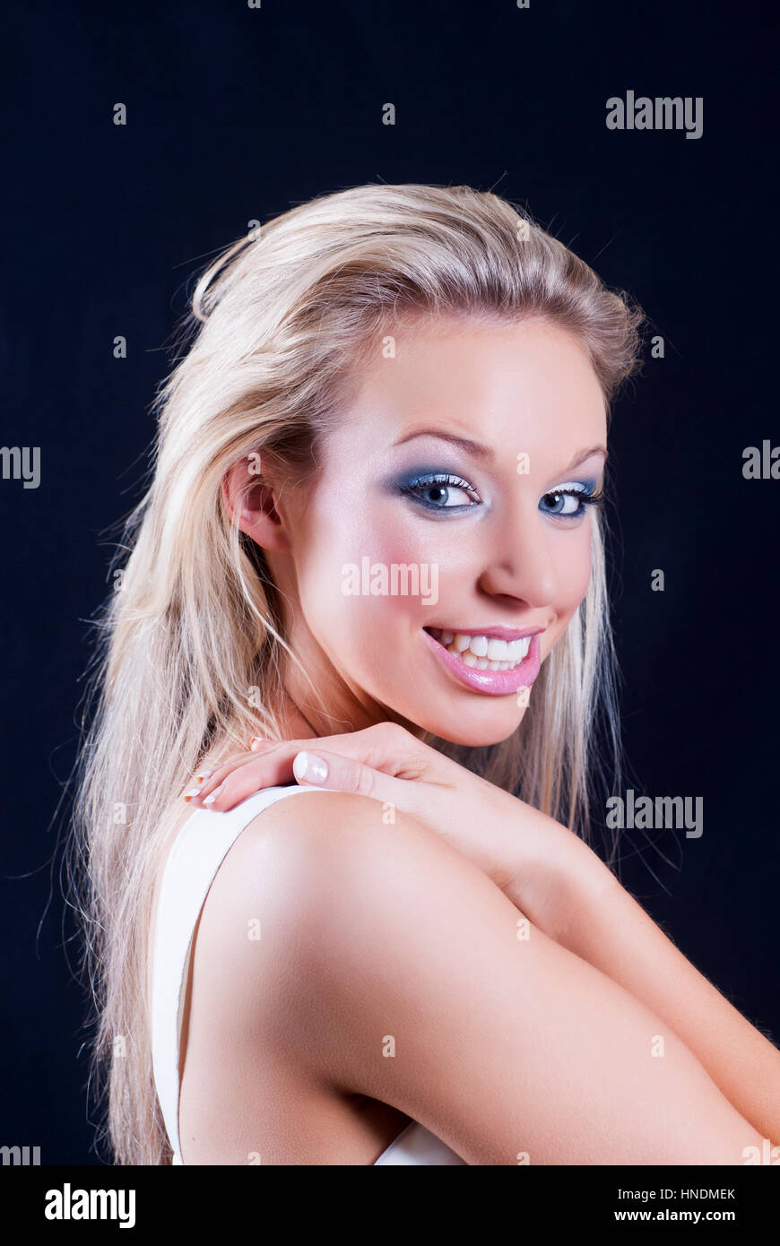 Beautiful young woman hand on shoulder smiling Stock Photo - Alamy