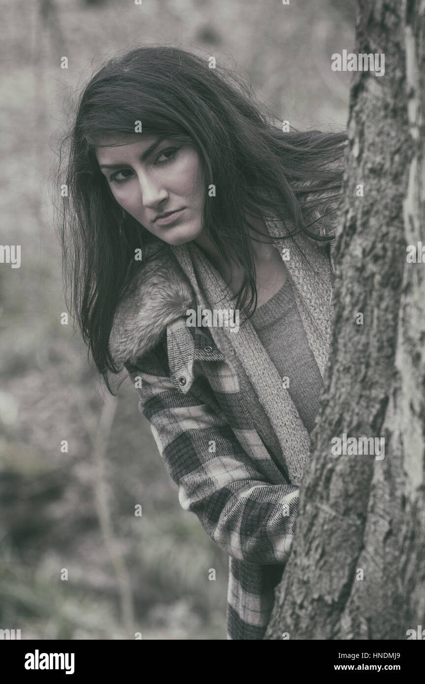 Scared Girl Hiding Behind Tree