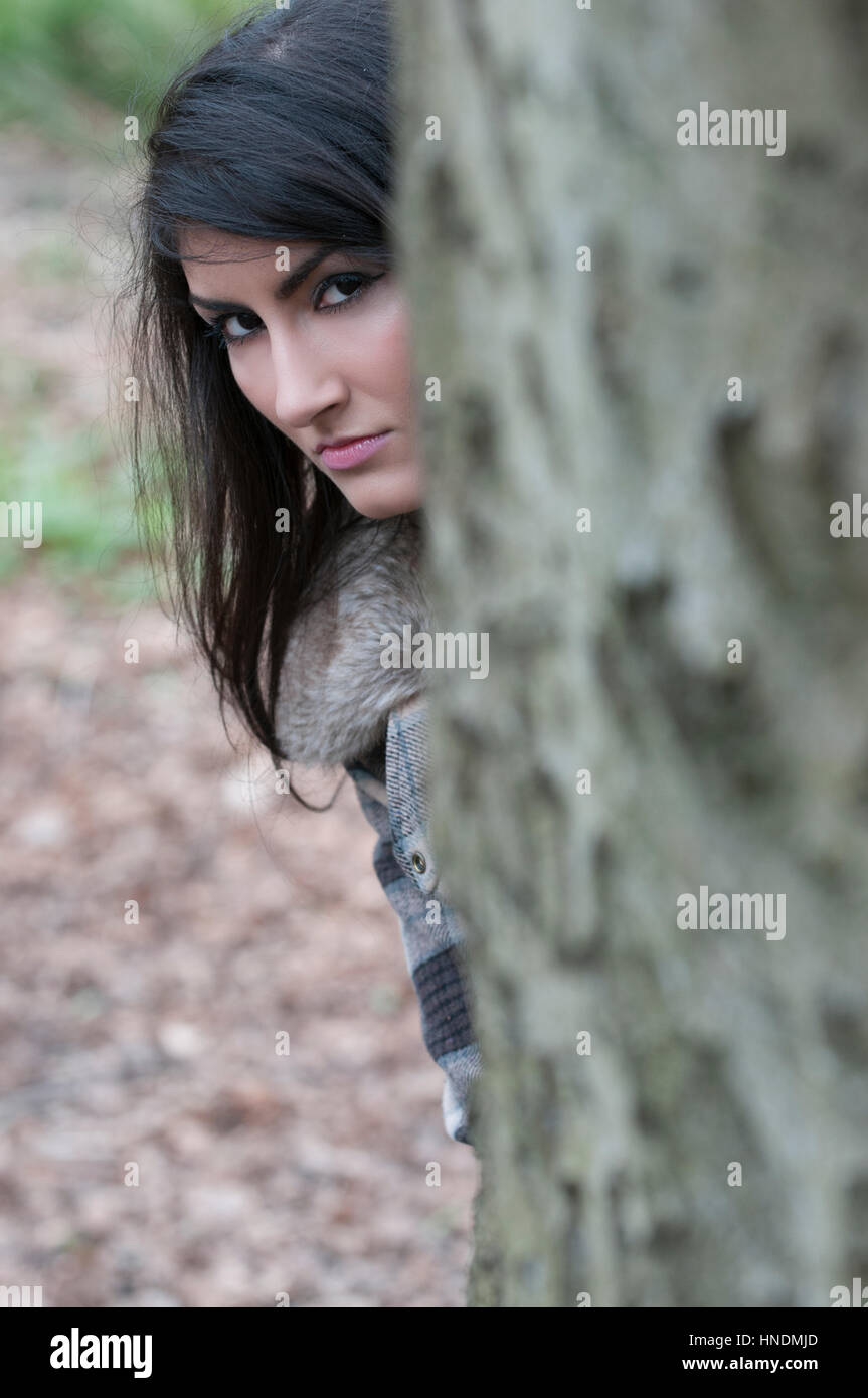 Portrait indian girl hiding behind hi-res stock photography and images ...