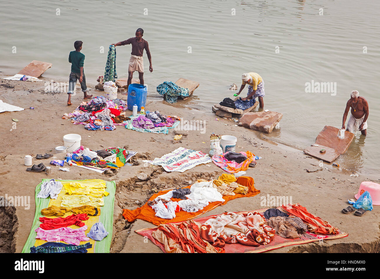 workers washing clothes, in Ganges river, Varanasi, Uttar Pradesh ...