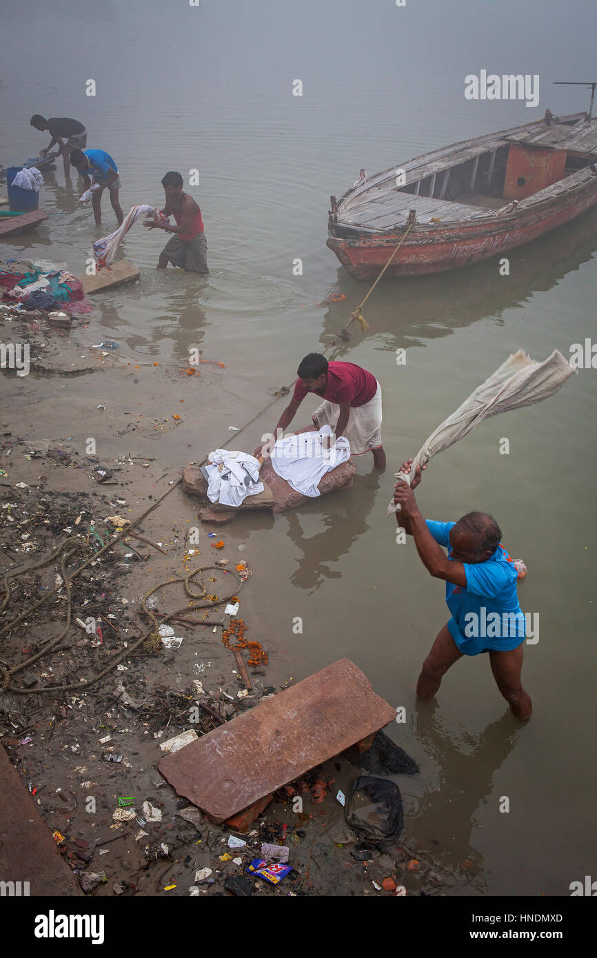workers washing clothes, in Ganges river, Varanasi, Uttar Pradesh ...