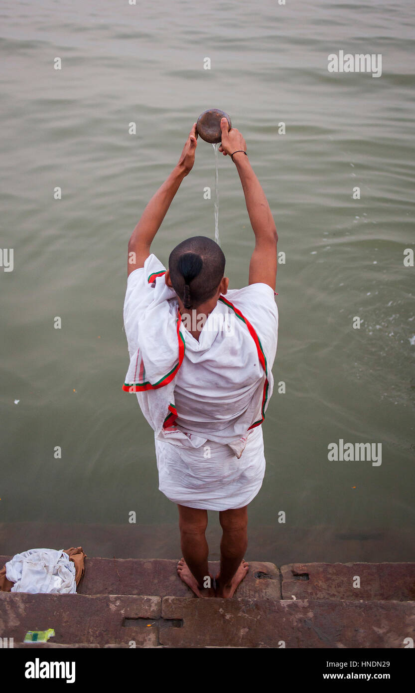 A man praying, in the ghats of Ganges river, Varanasi, Uttar Pradesh ...