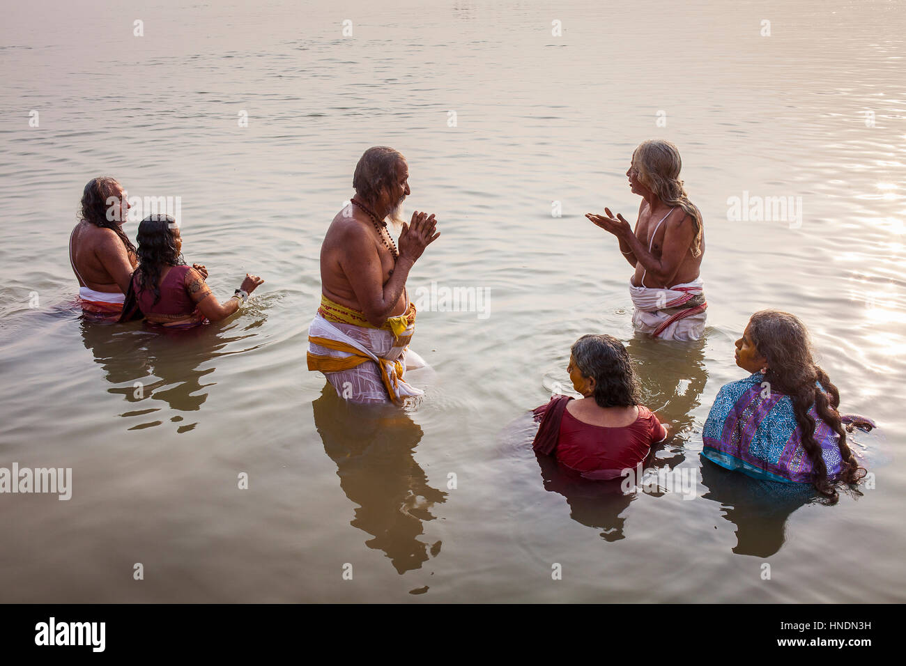 Pilgrims praying and bathing, in the ghats of Ganges river, Varanasi ...