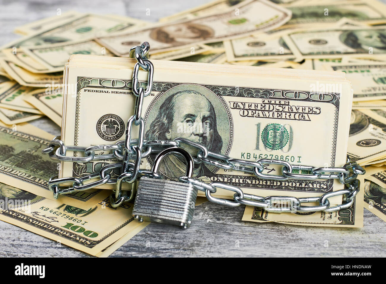 Money under lock and key Stock Photo - Alamy