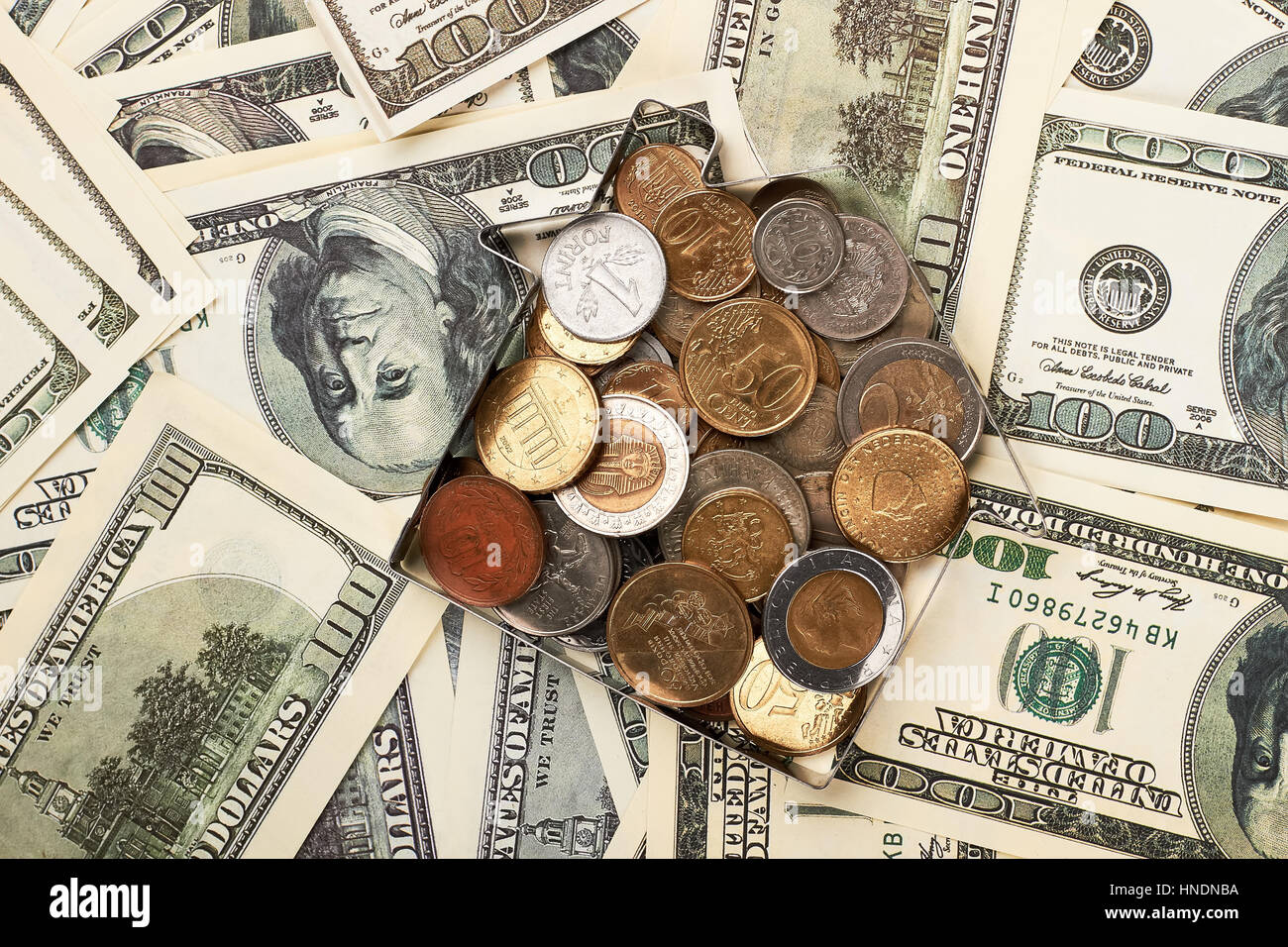 Dollars and coins Stock Photo - Alamy