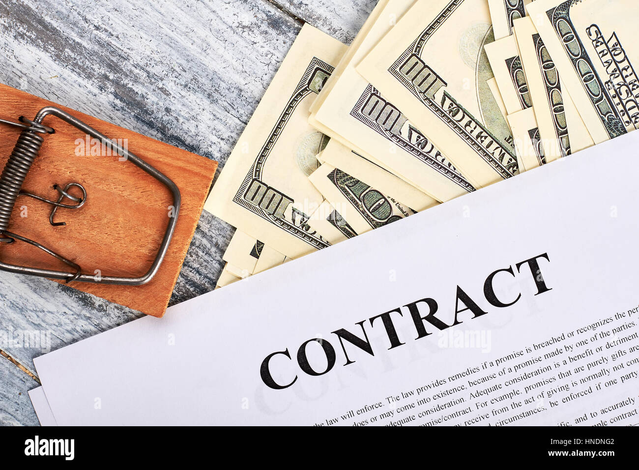 Contract, money and mousetrap Stock Photo - Alamy
