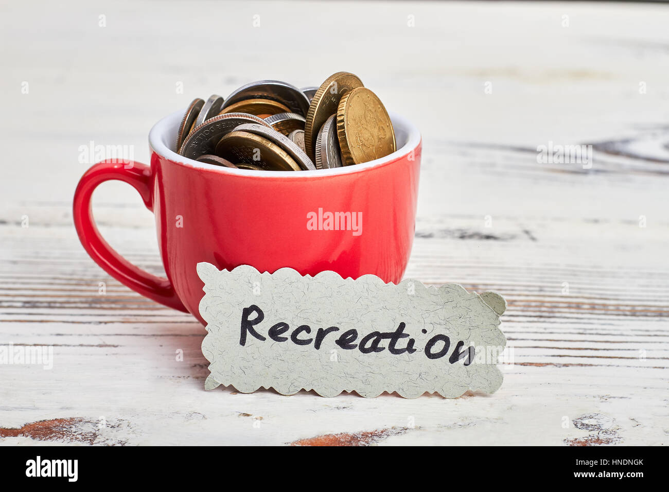 Coins in cup and card Stock Photo - Alamy