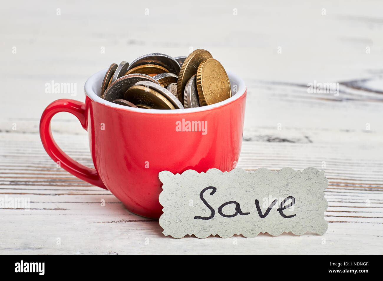 Coins in cup hi-res stock photography and images - Alamy