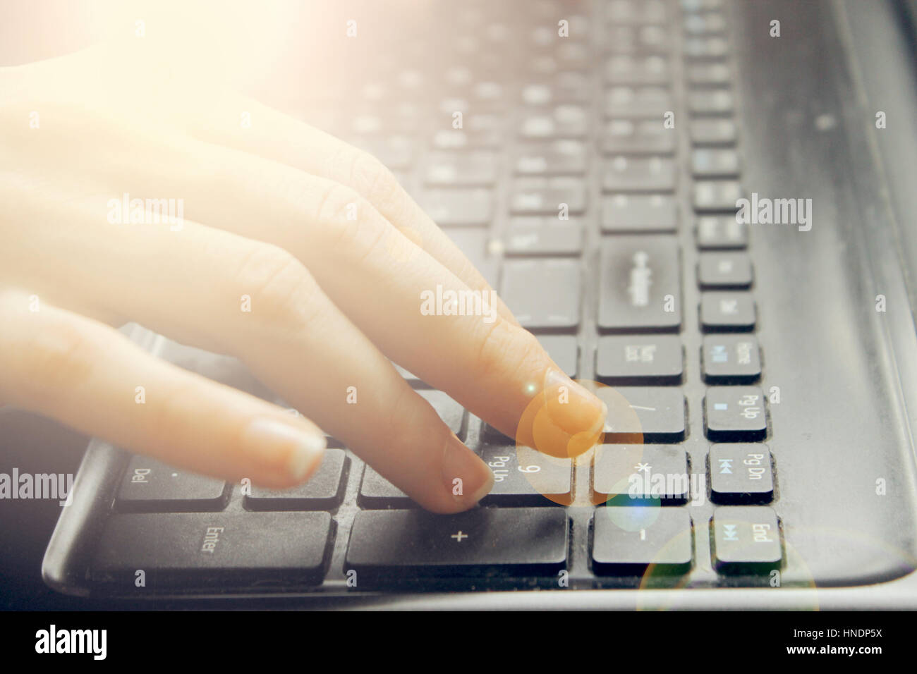 the girl presses keys notebook closeup, Soft light effect Stock Photo ...