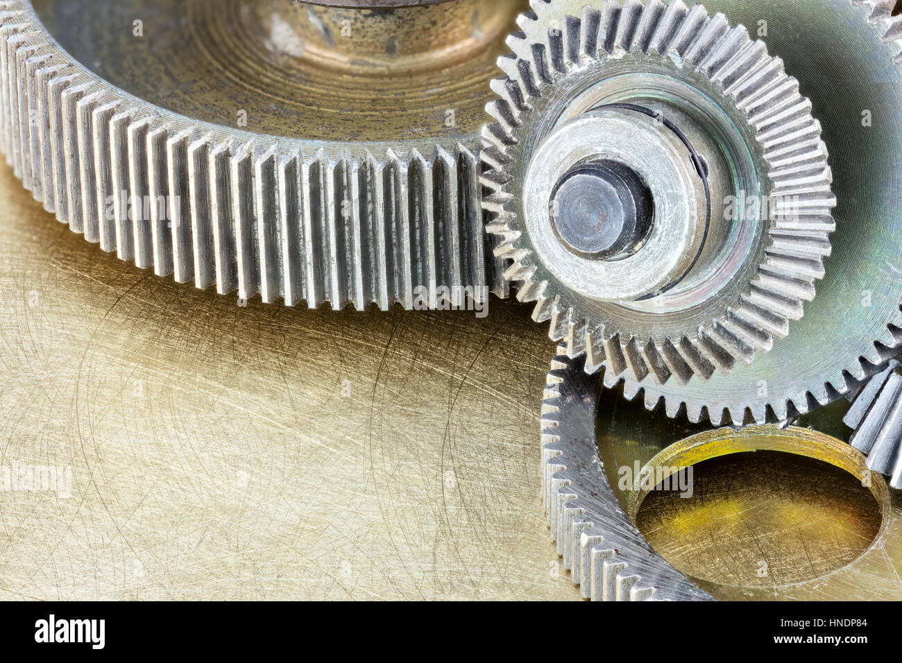 machinery details. metal gears and cogwheels on scratched background ...
