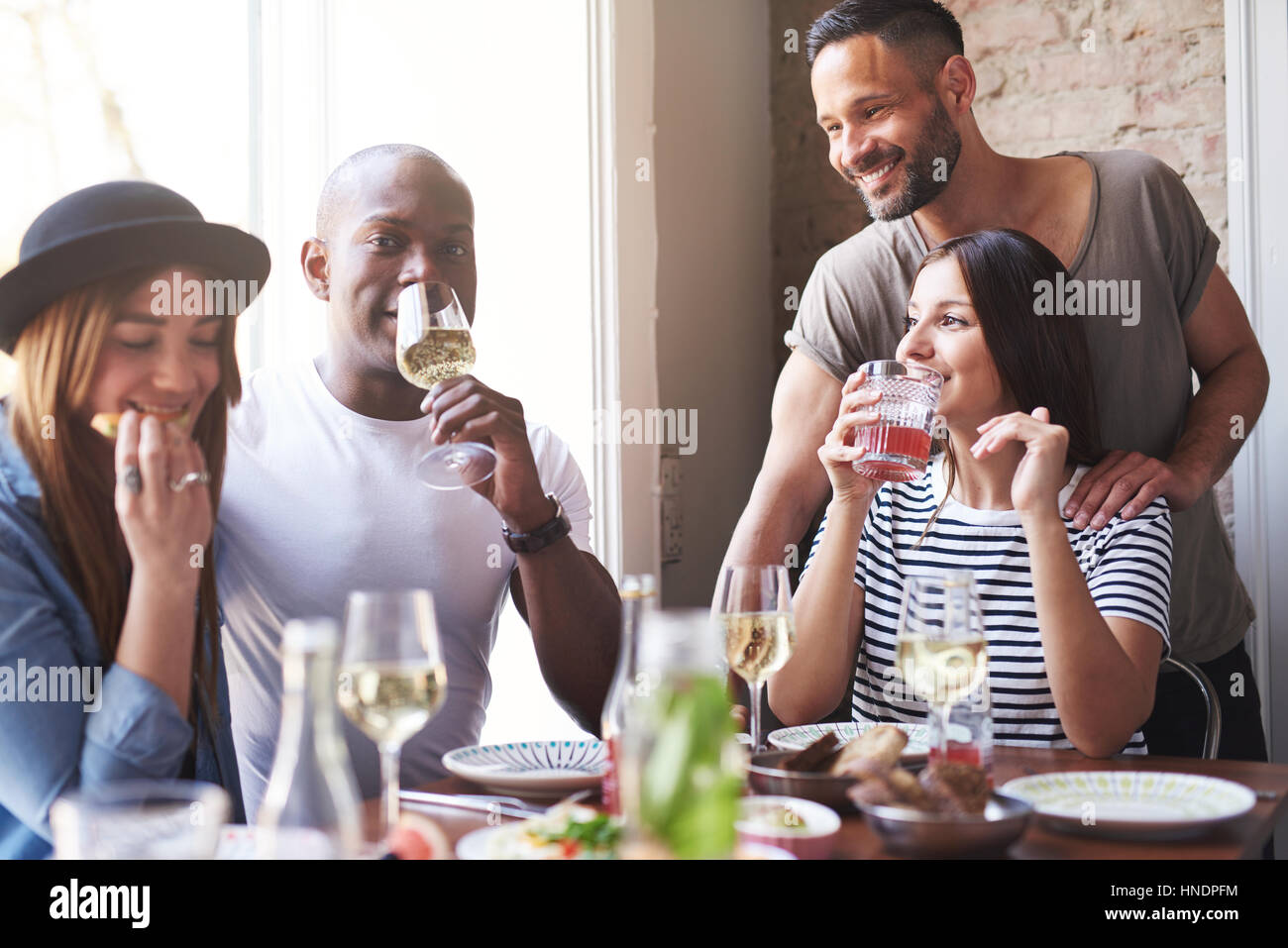 People laughing at dinner table hi-res stock photography and images - Alamy