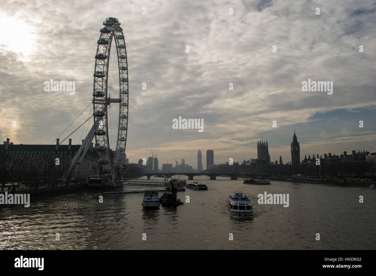Houses of Parliament and the London Eye on a hazy morning Stock Photo ...