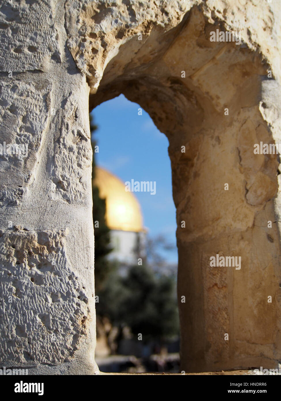 The view through a stone window in historic Jerusalem includes the ...