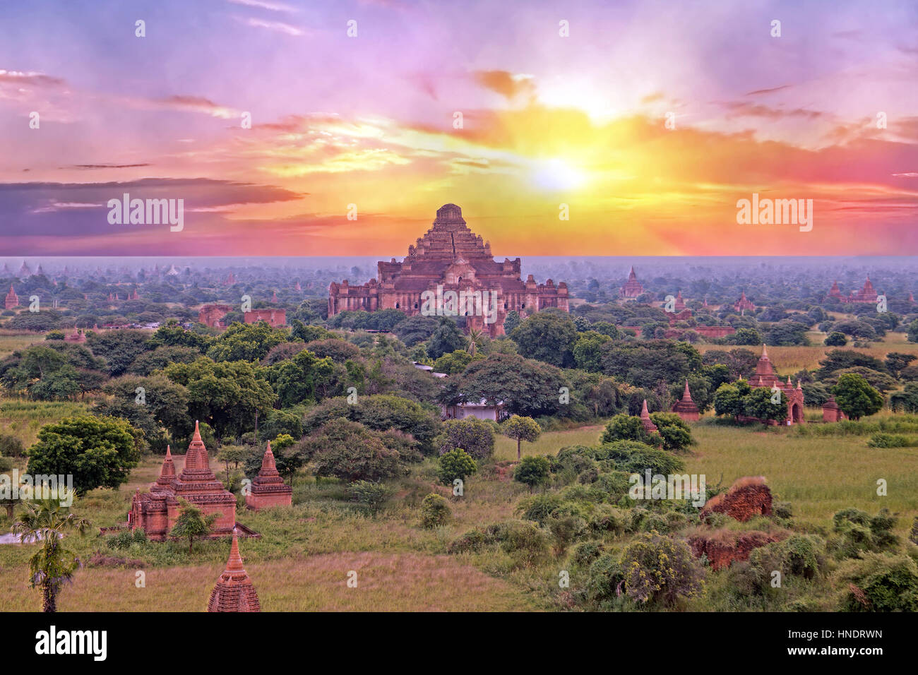 Ancient pagodas in the landscape from Bagan in Myanmar at sunrise In ...