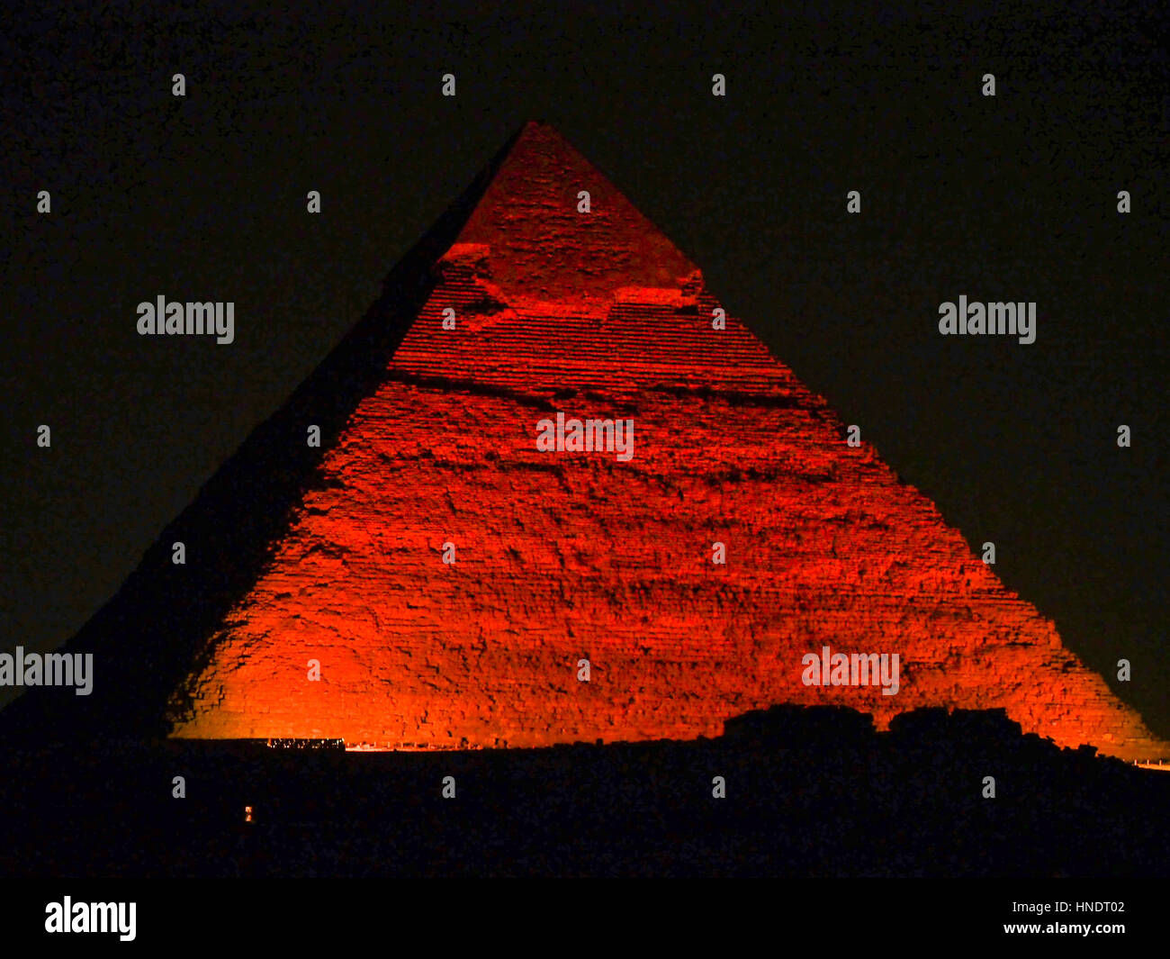 A great pyramid at Giza lit up with red light during the evening night ...