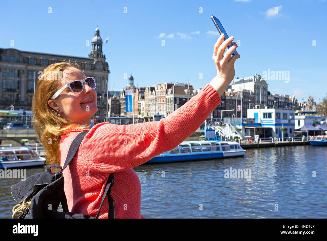 Young native dutch woman making a selfie in the city center from ...