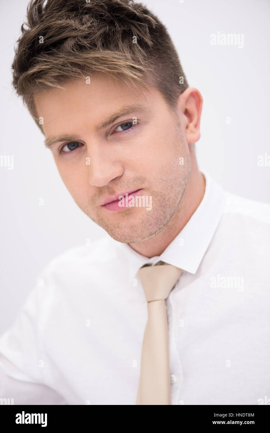 Portrait of a young handsome man in a representative strict clothing ...