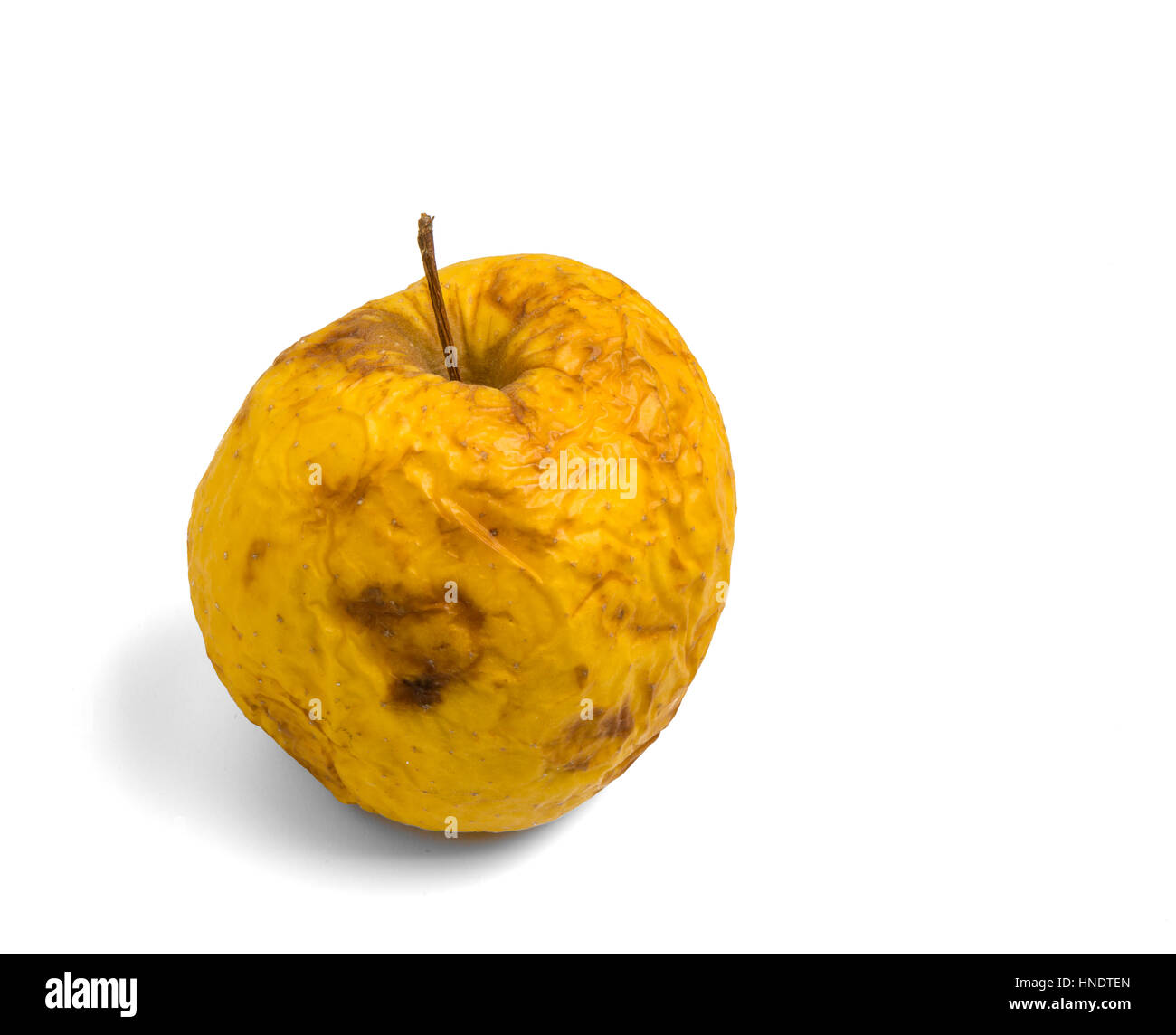 One yellow rotten apple isolated on a white background Stock Photo - Alamy