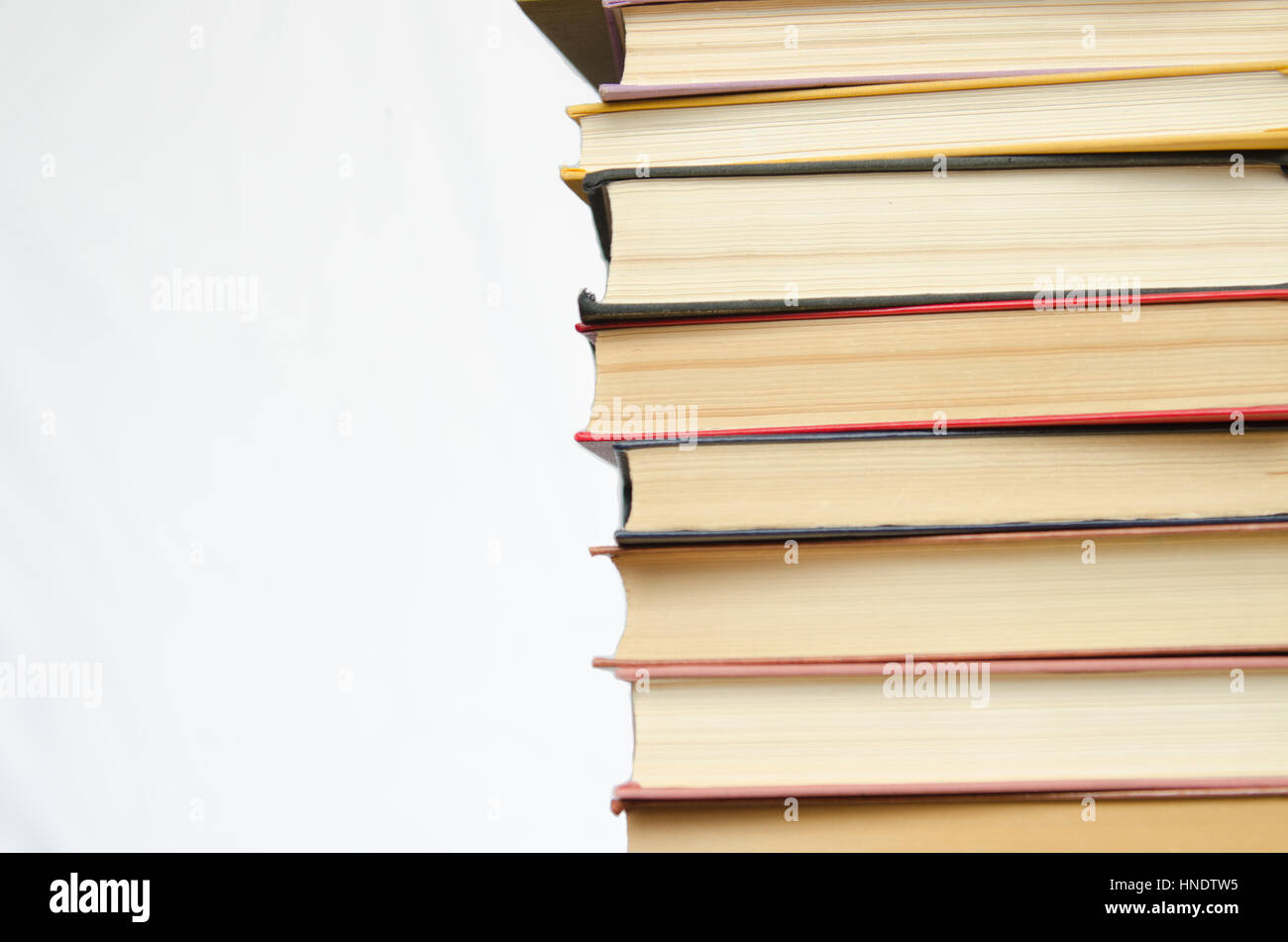 a stack of colorful books in a library or a room isolated Stock Photo ...