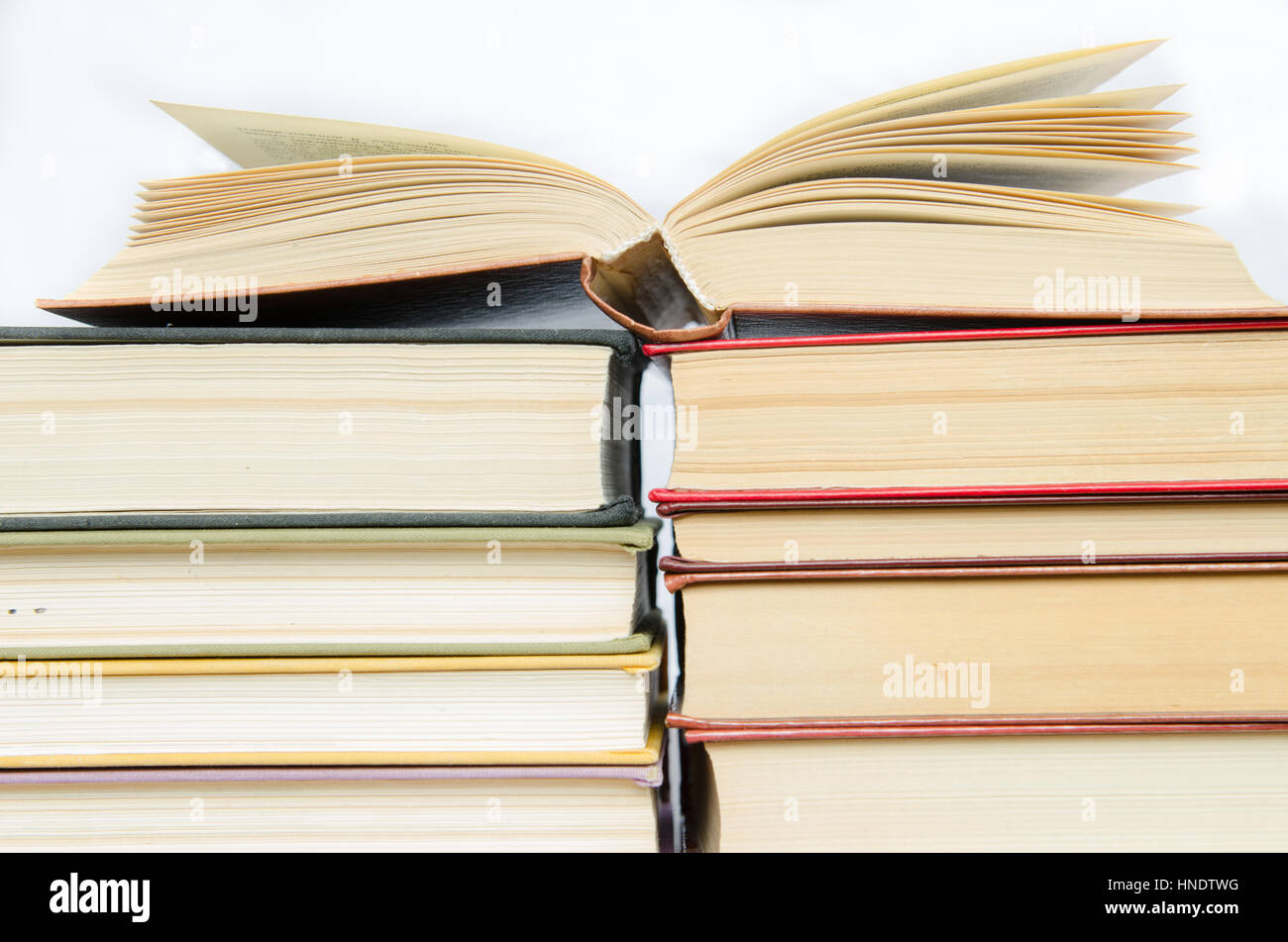 a stack of colorful books in a library or a room isolated Stock Photo ...