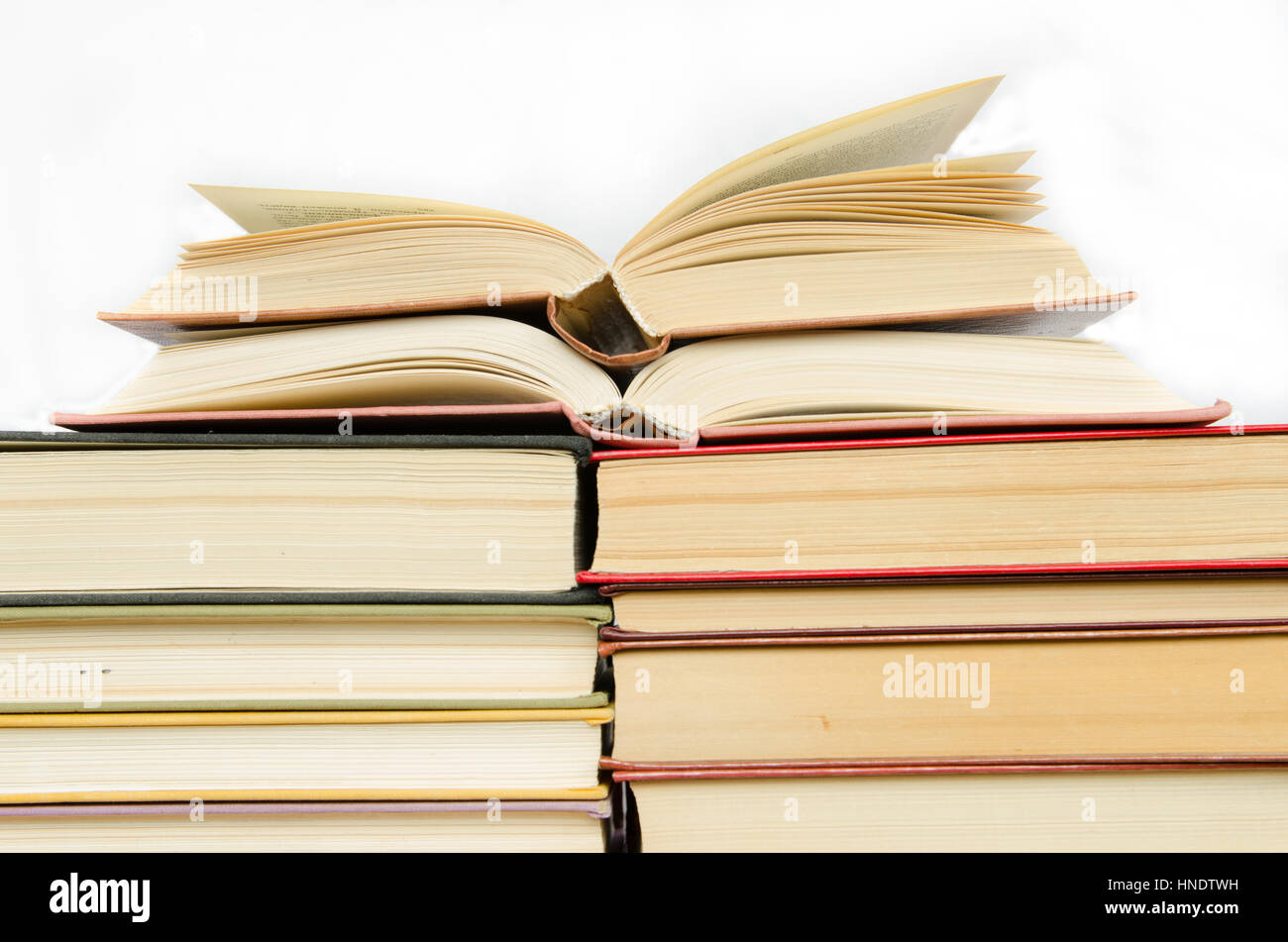 a stack of colorful books in a library or a room isolated Stock Photo ...