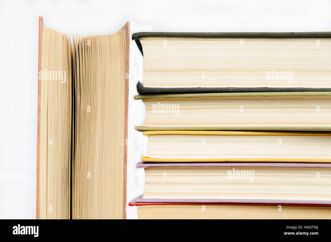 a stack of colorful books in a library or a room isolated Stock Photo ...
