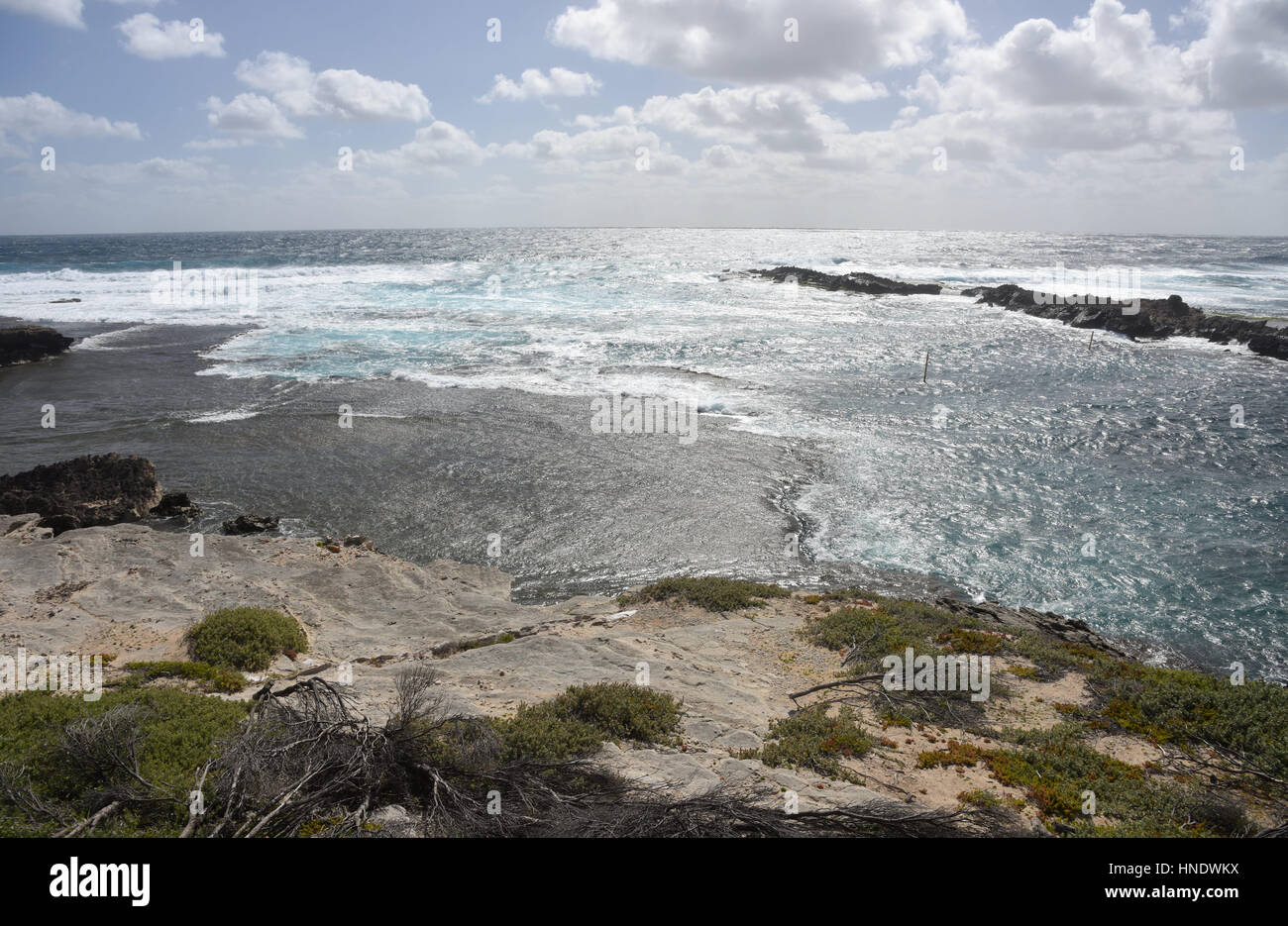 Indian Ocean waves rolling over the limestone rock formations at ...