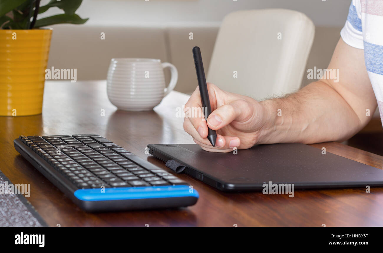 Designer using graphic tablet office hi-res stock photography and ...