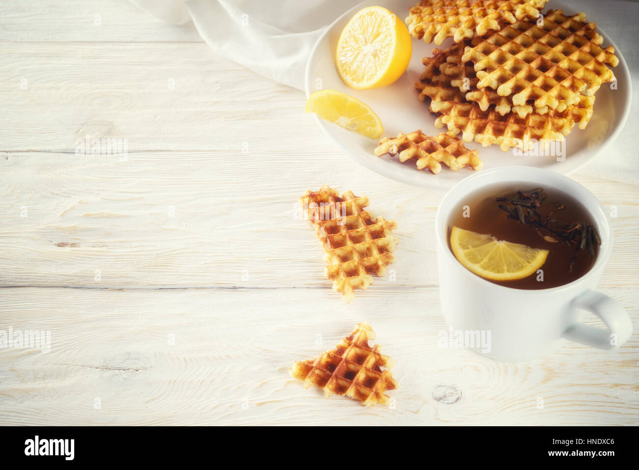 Tea with lemon and wafer Stock Photo - Alamy