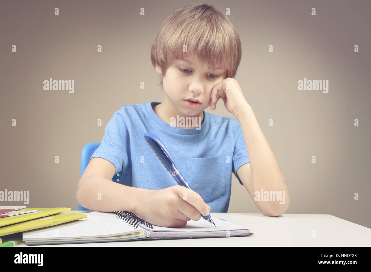 Boy doing english homework school hi-res stock photography and images ...