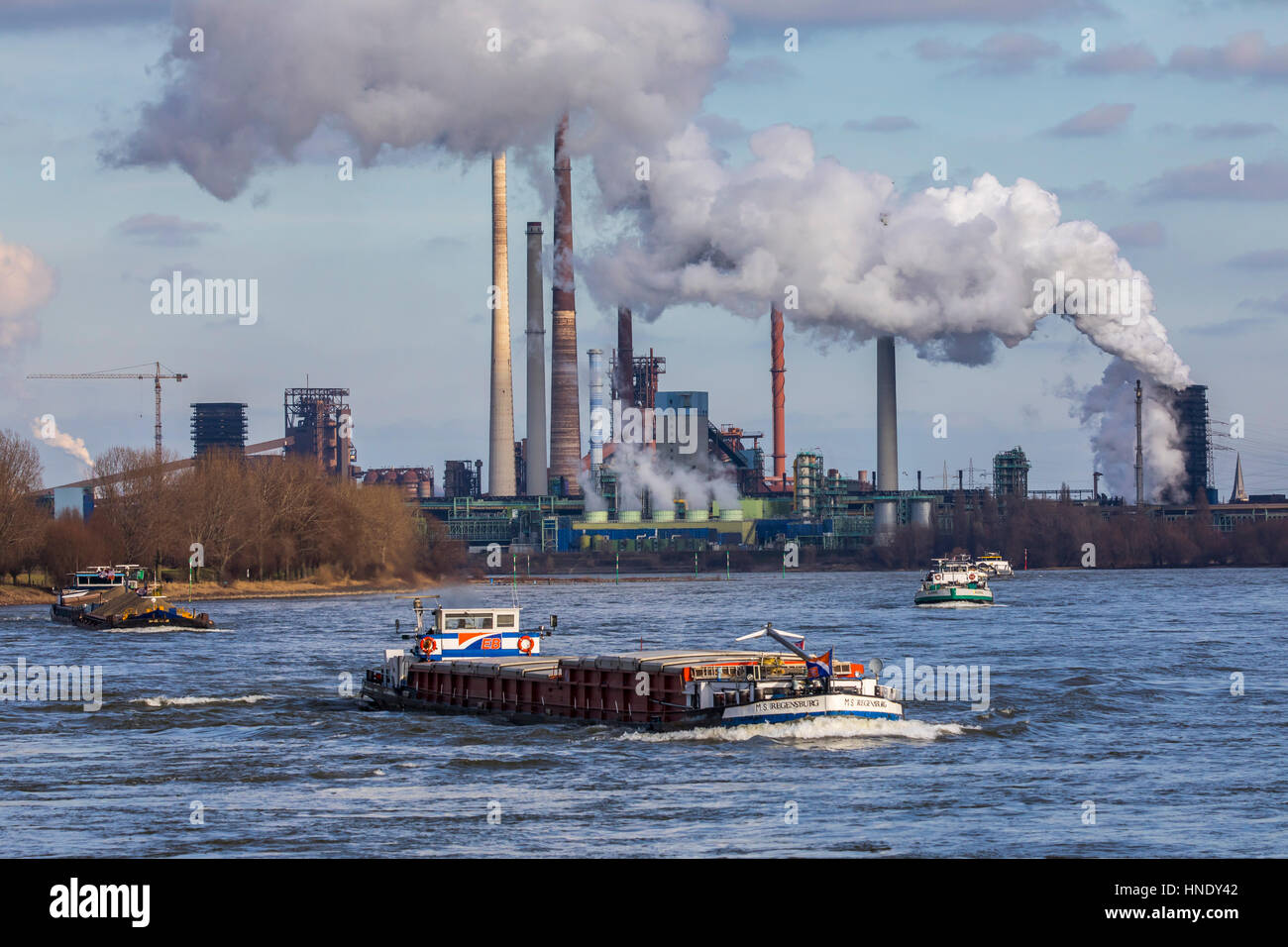 Freight ships on the Rhine near Duisburg, ThyssenKrupp steelworks in ...